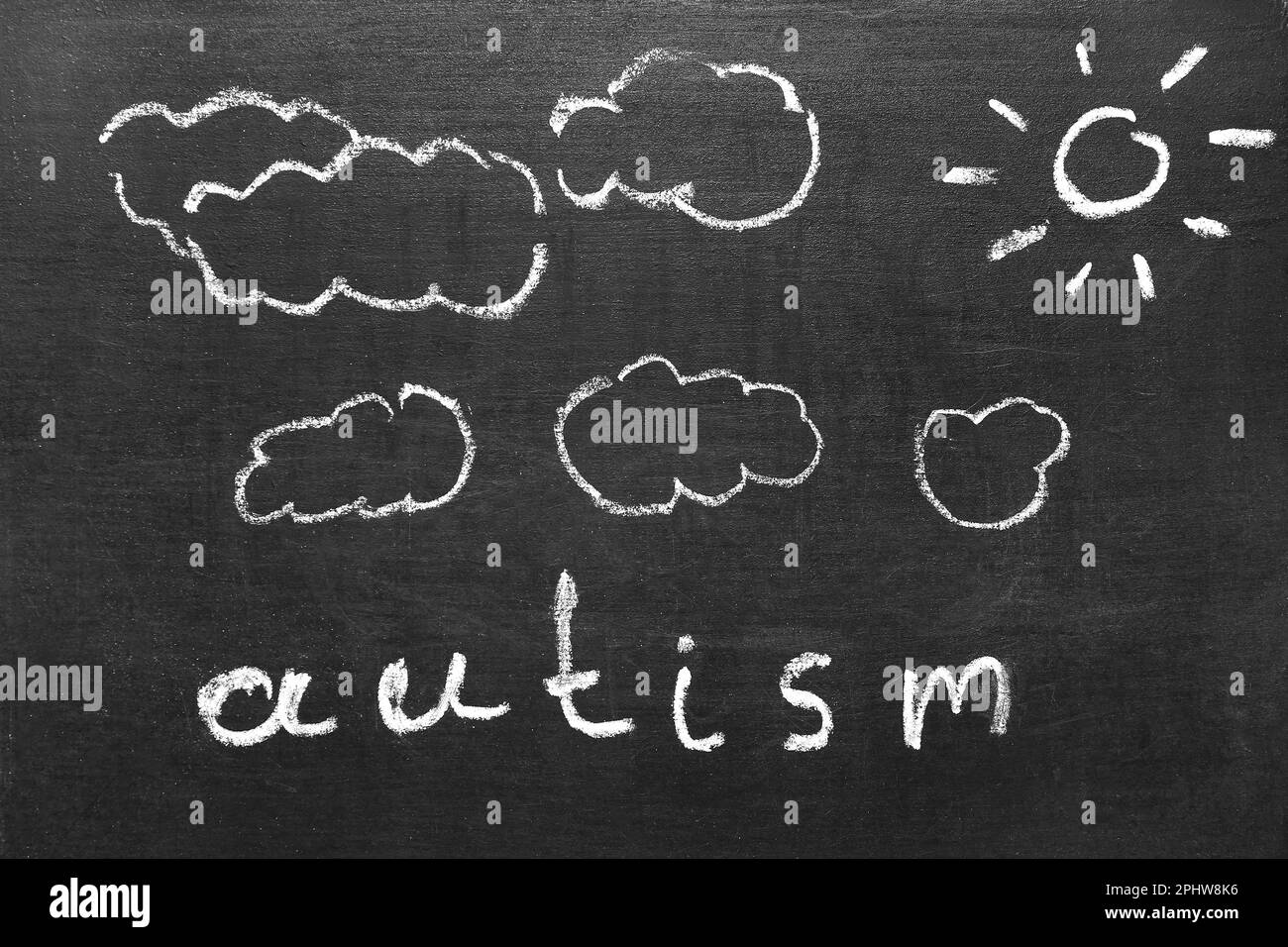 Word AUTISM with drawn clouds and sun on dark background Stock Photo ...