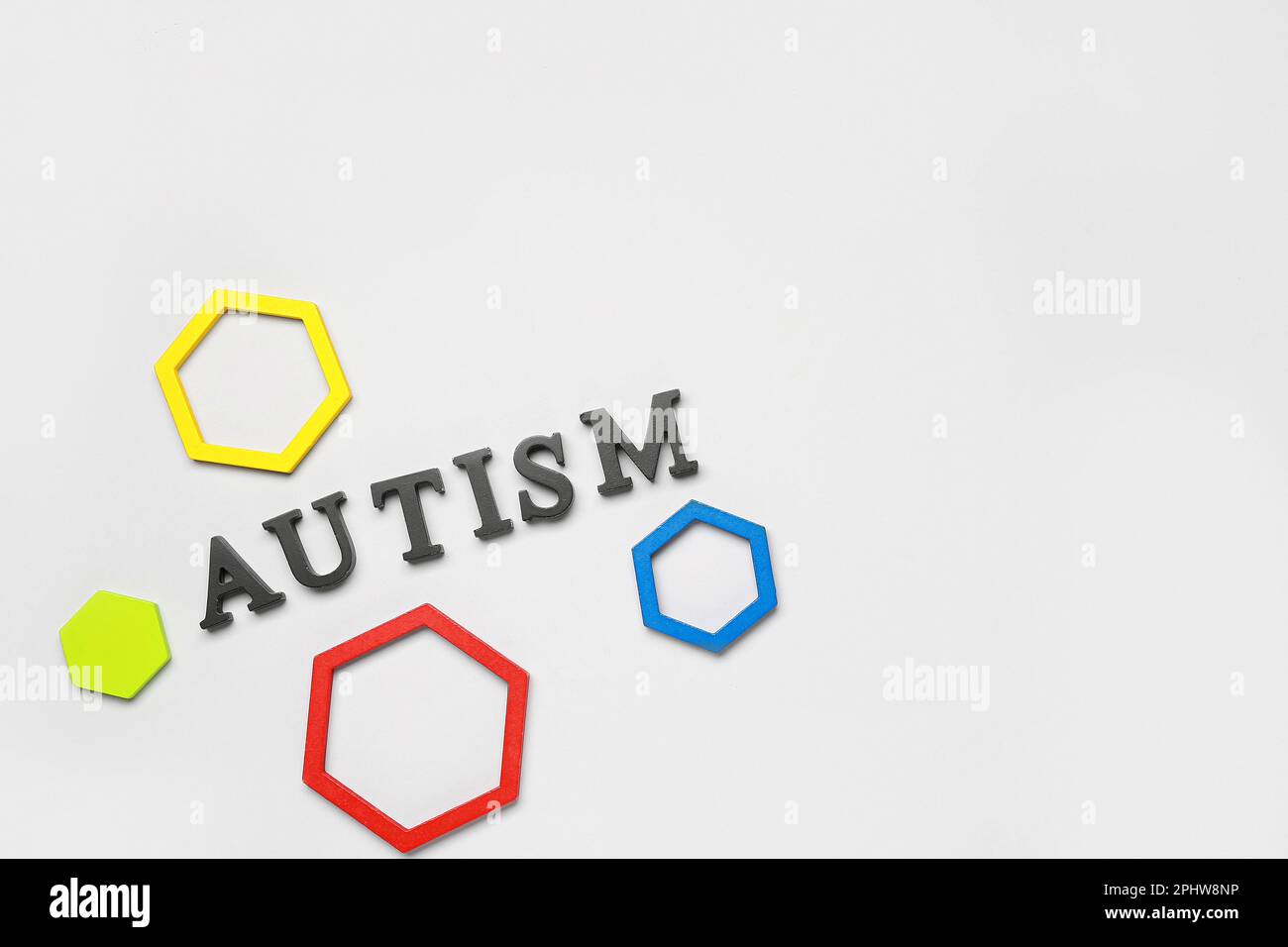 Word AUTISM with baby blocks on grey background Stock Photo - Alamy