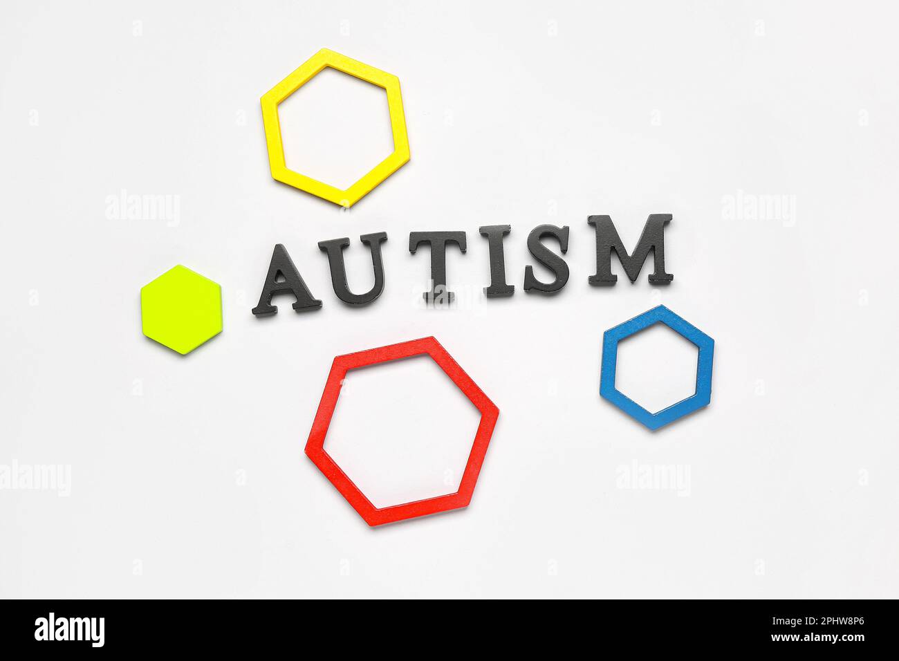 Word AUTISM with baby blocks on grey background Stock Photo - Alamy