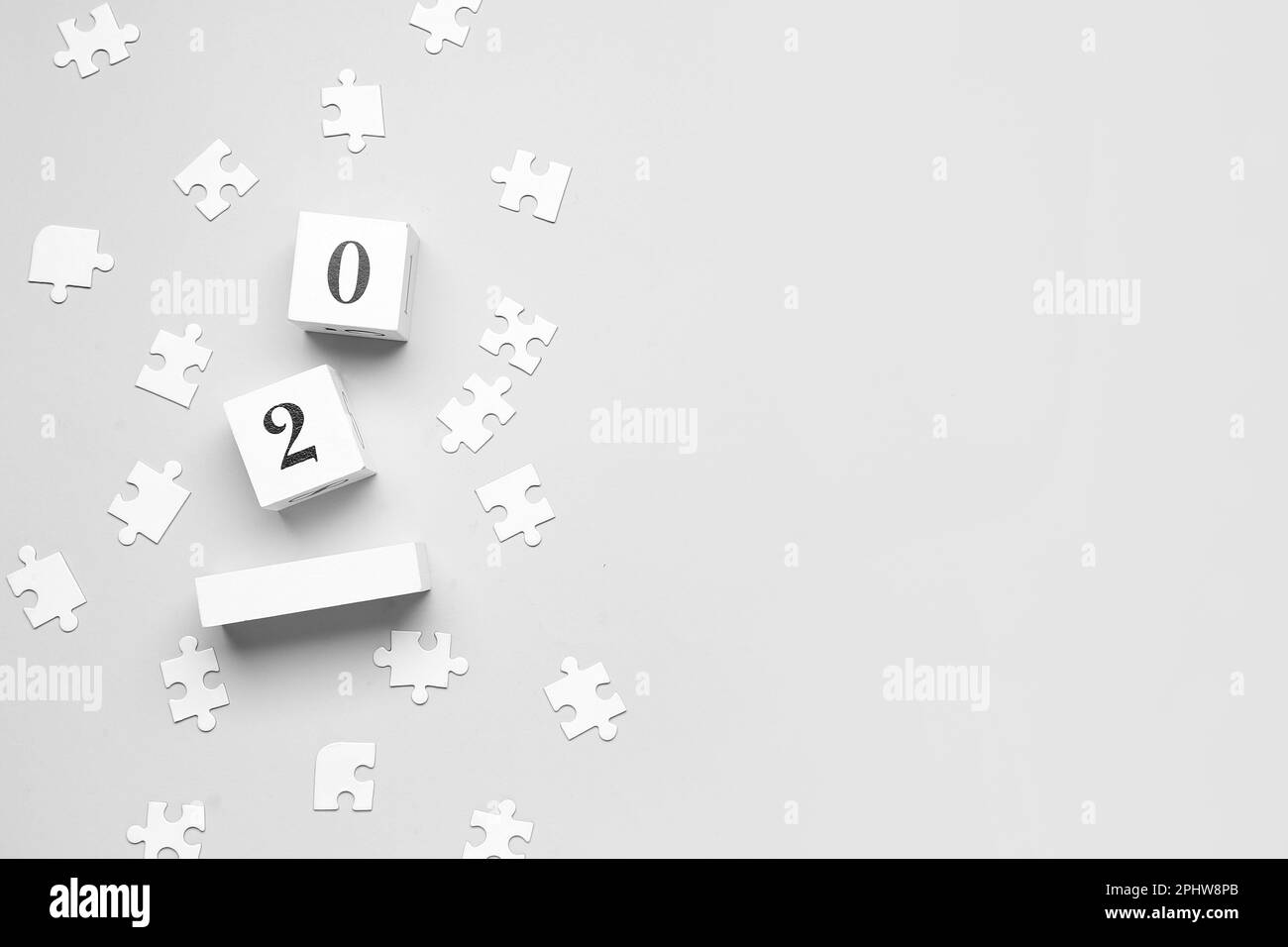 Date of World Autism Awareness Day with puzzle pieces on grey ...