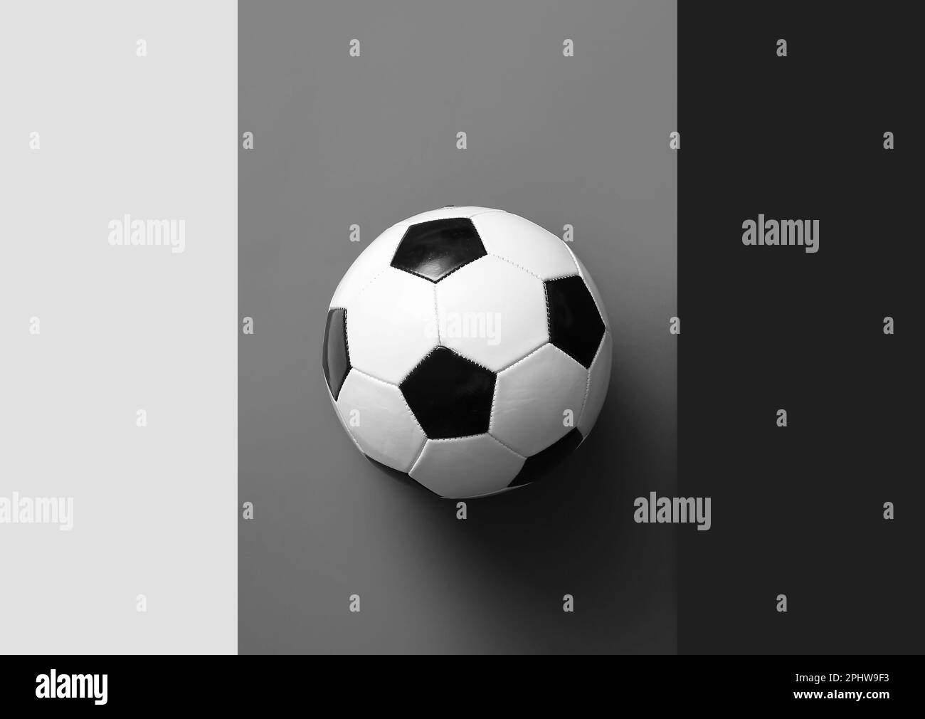 Soccer ball on grey background Stock Photo - Alamy
