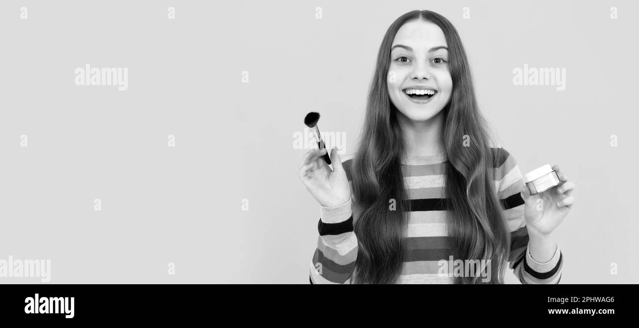 I love changing my makeup. Happy child apply cosmetics. Girl smile ...