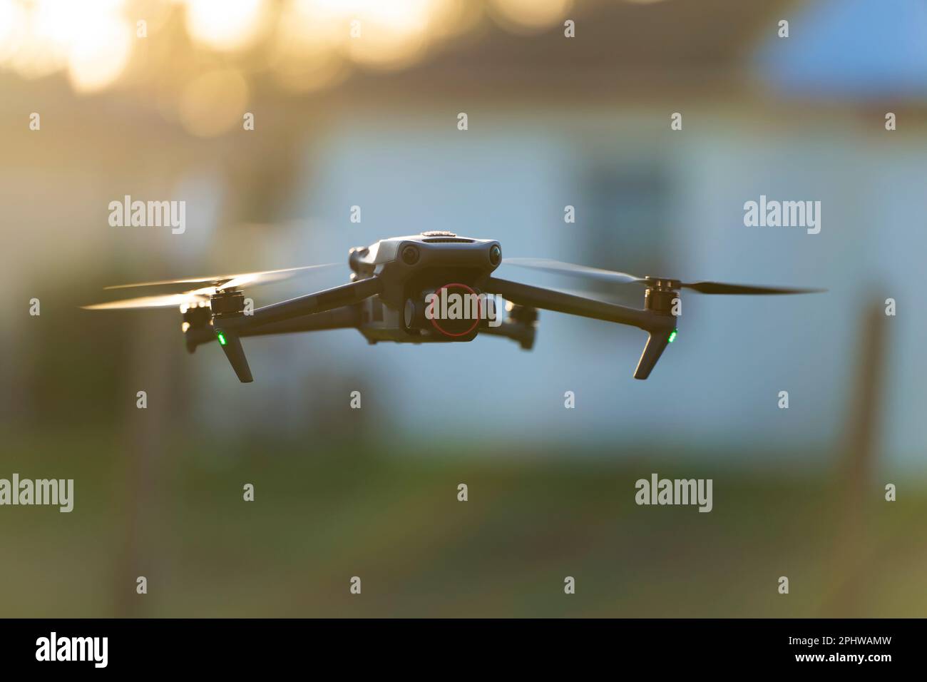 Drone aircraft with blurred fast rotating propellers and video camera ...