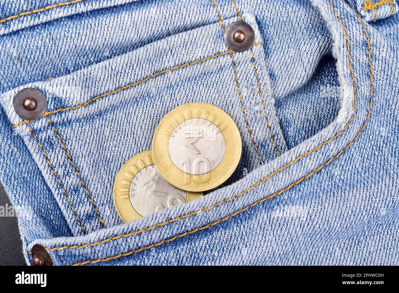 Top view of indian currency coin in pocket Stock Photo - Alamy