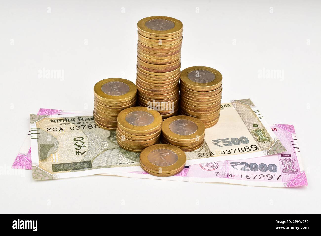 Indian currency coin and banknote on white background Stock Photo - Alamy