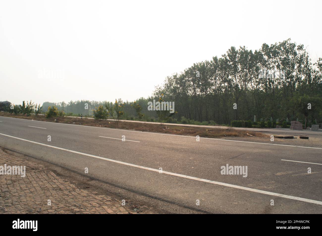 Clean and empty highway road in india Stock Photo - Alamy