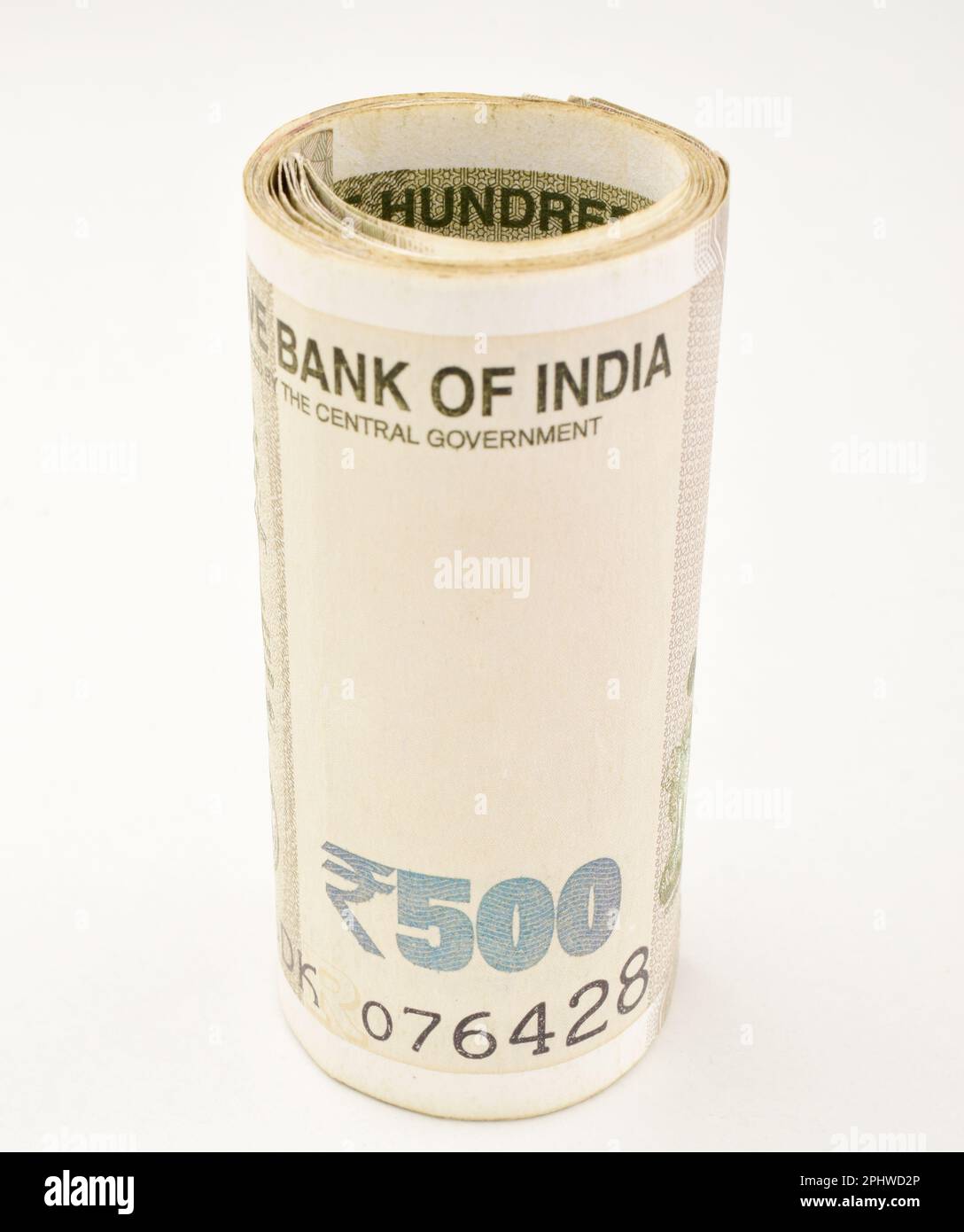 Roll of indian rupee note on white background Stock Photo - Alamy