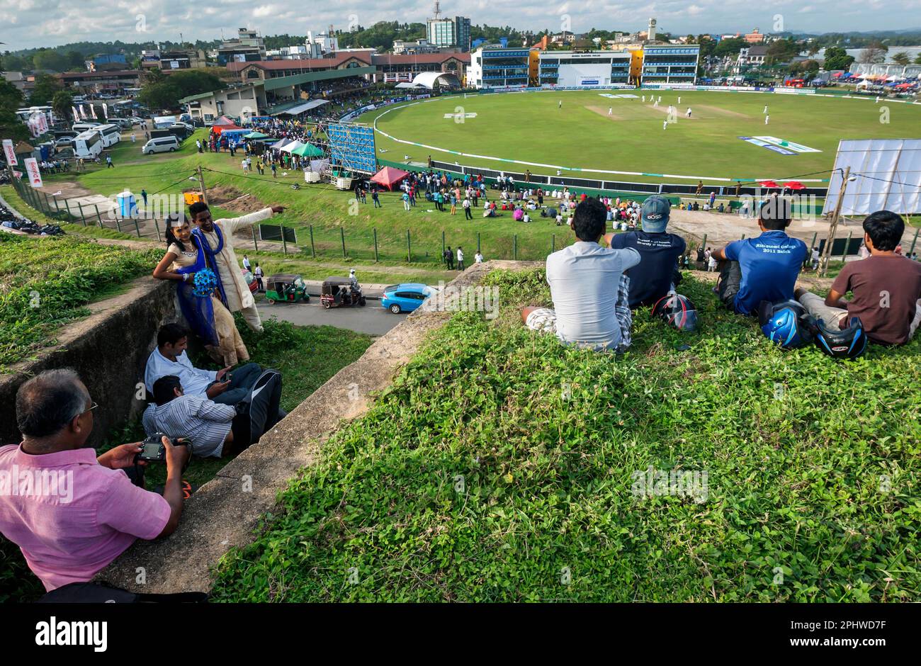 A newly married couple stand amongst spectators on the old Dutch Fort ...