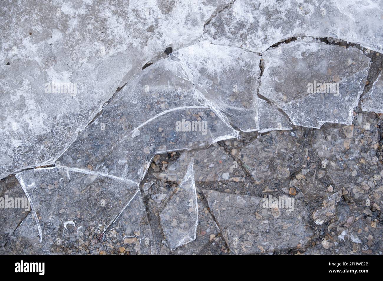 Sheet of Cracked ice covering a parking lot in winter Stock Photo - Alamy