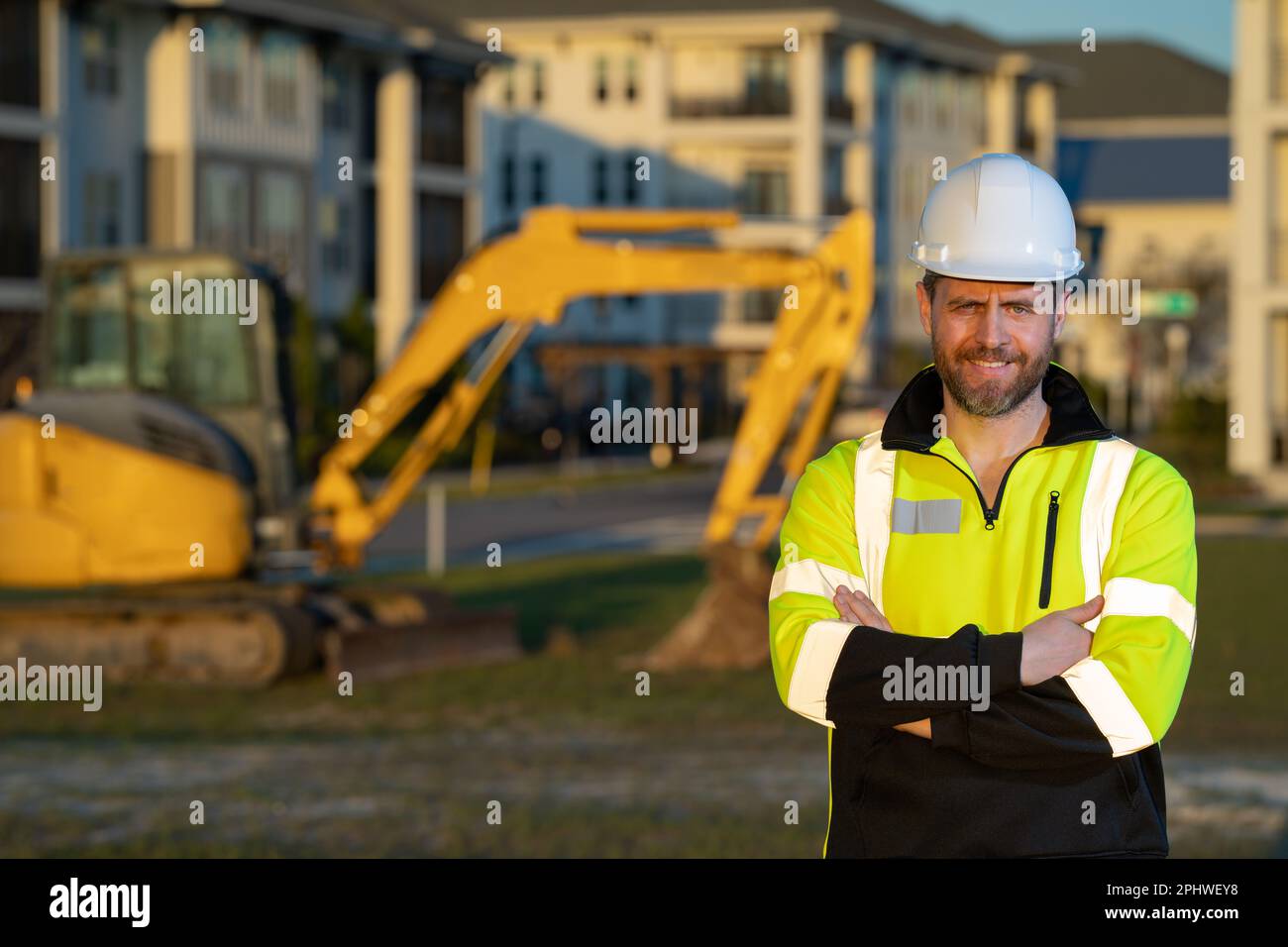 Worker with bulldozer on the building construction Stock Photo - Alamy