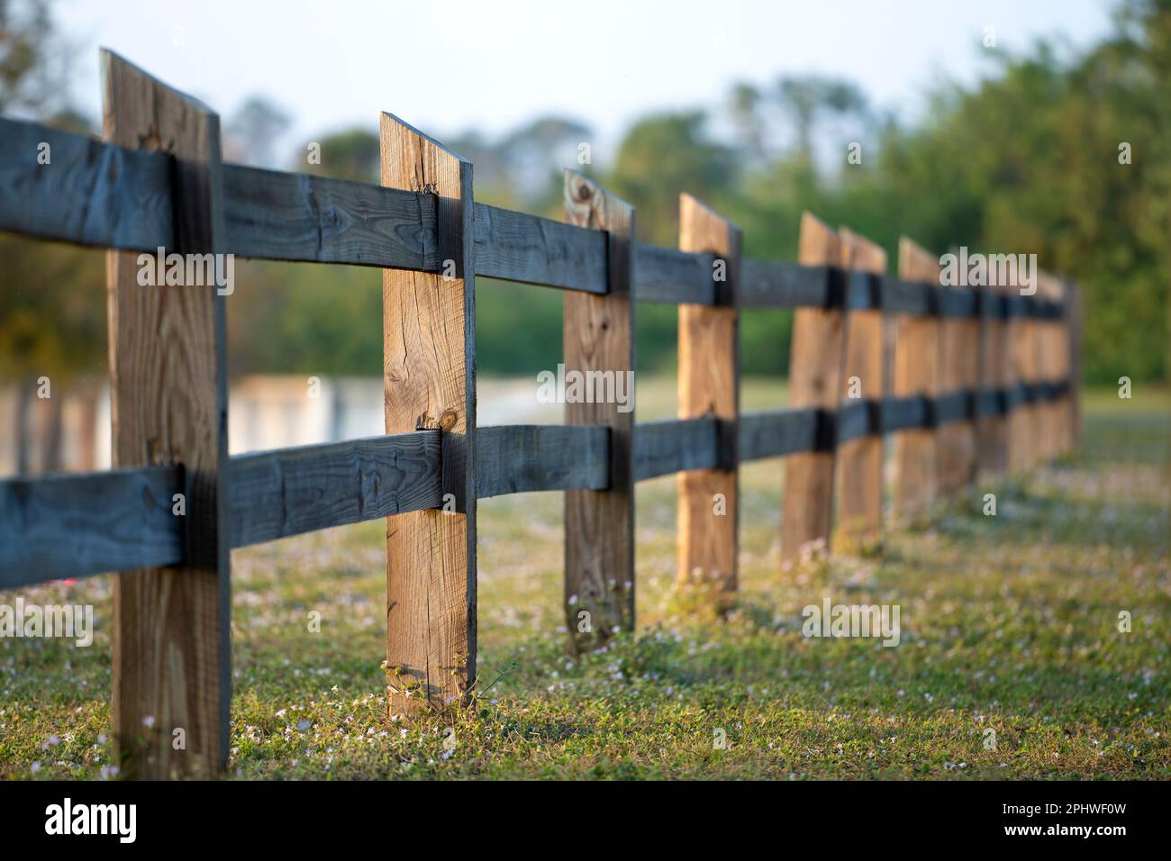 Wooden fence barrier at farm grounds for cattle and territory ...