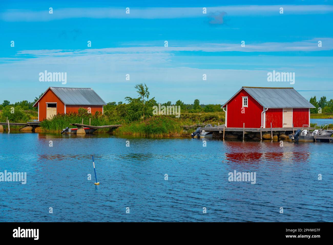 Red timber boat houses at Svedjehamn in Finland Stock Photo - Alamy