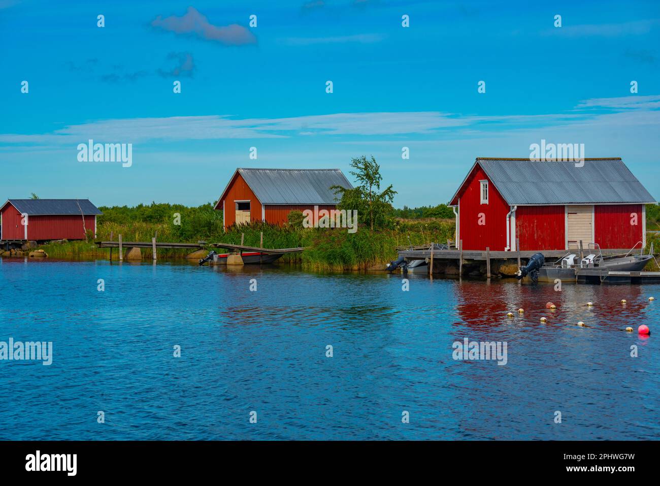 Red timber boat houses at Svedjehamn in Finland Stock Photo - Alamy