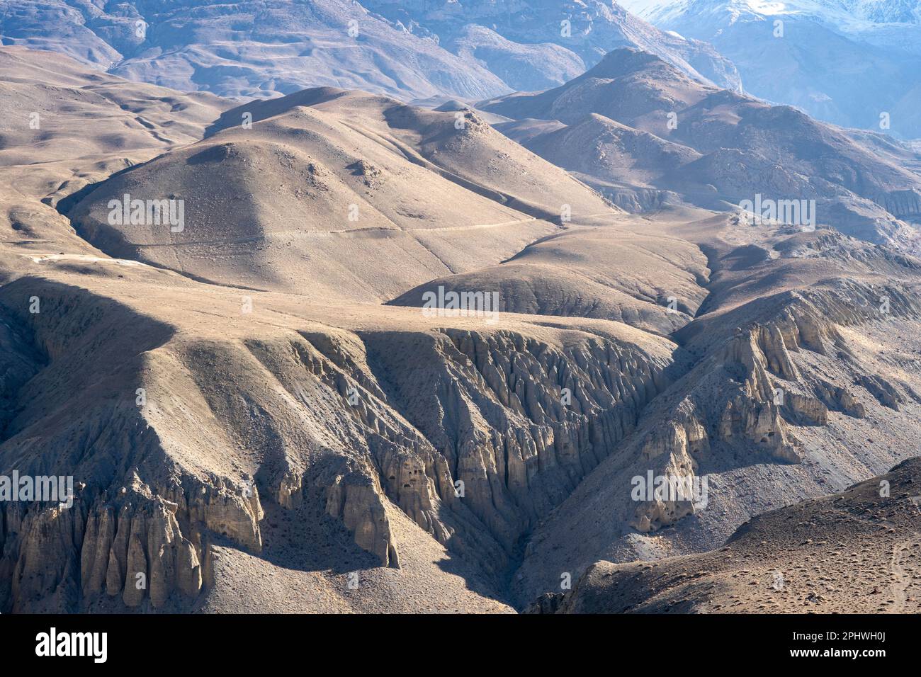 The sky caves of the Mustang Region of Nepal in the barren desert land ...