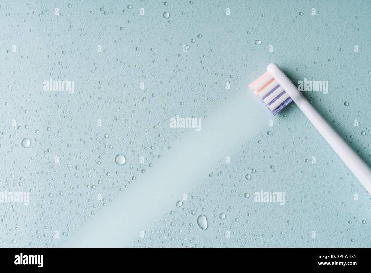 Dry and clean toothbrush marks on glass surface with water drops Stock ...