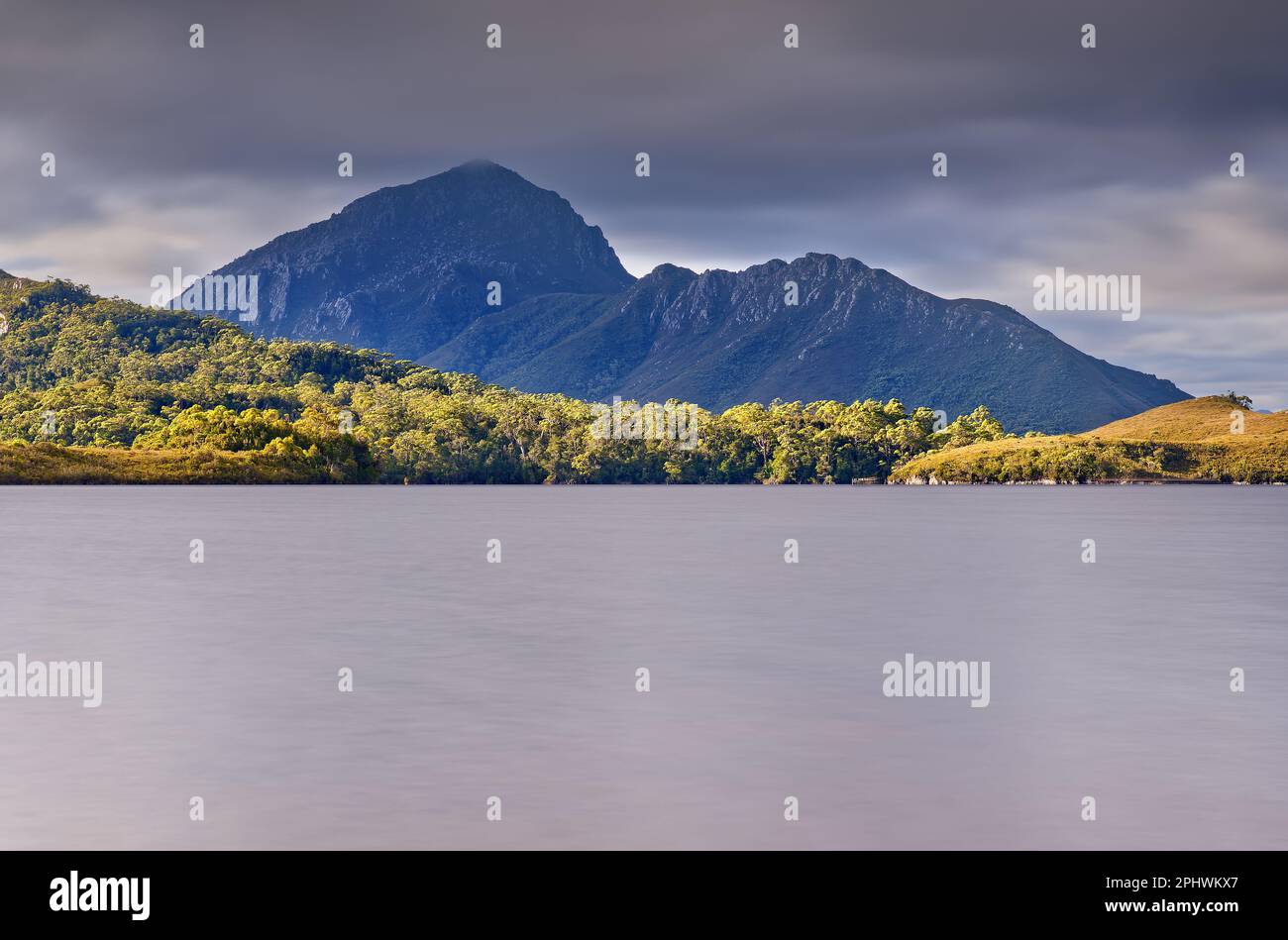 Afternoon light on Mount Rugby across Forest lagoon, Melaleuca, South ...