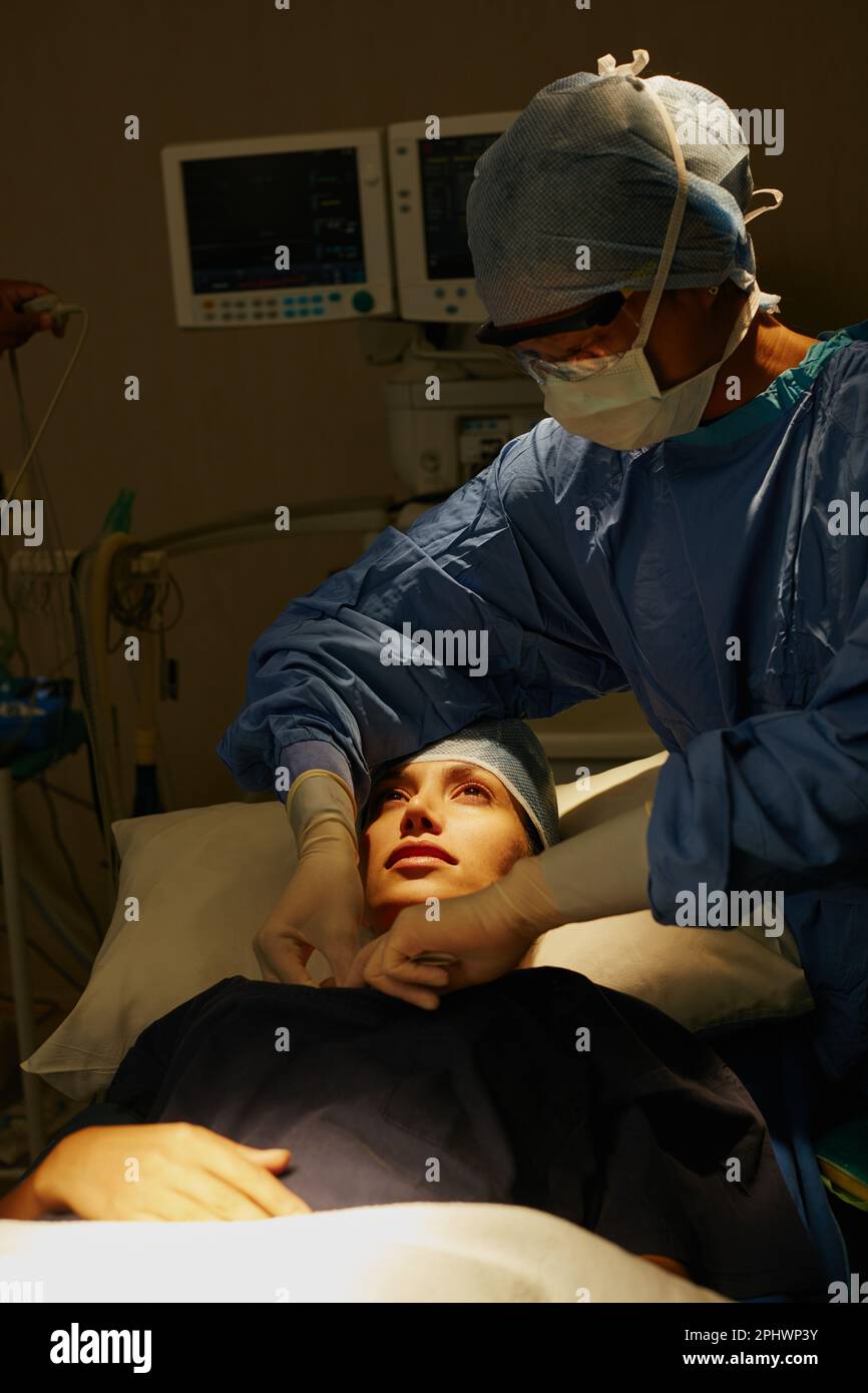 Shes got a great bedside manner. a surgeon preparing a patient for her ...