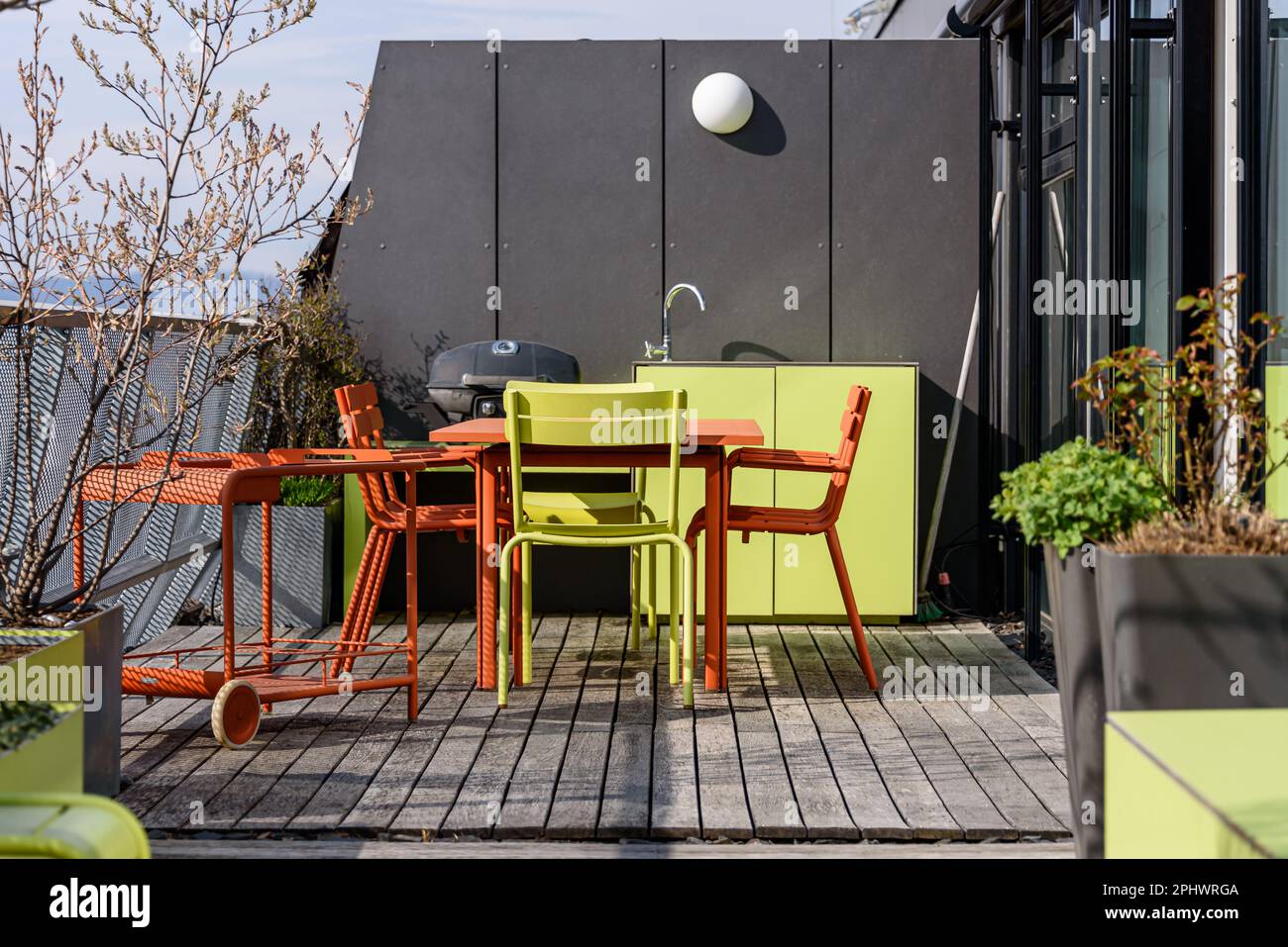 Rooftop terrace with green and terracotta furniture in Vienna Stock ...