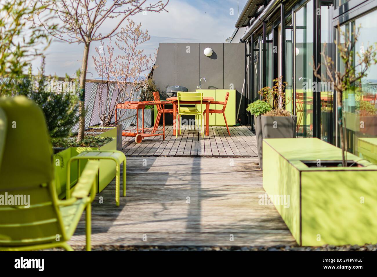 Rooftop terrace with green and terracotta furniture in Vienna Stock ...