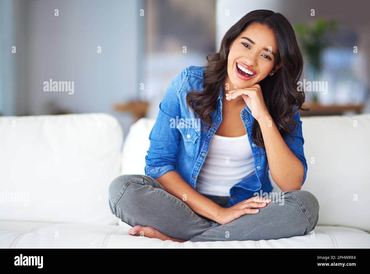 I live for the weekend. a young woman relaxing at home on the weekend ...