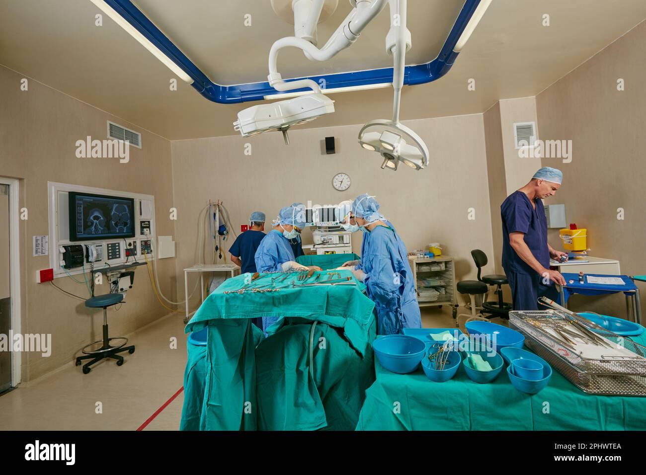 Their skills save lives. a team of surgeons performing a surgery in an ...