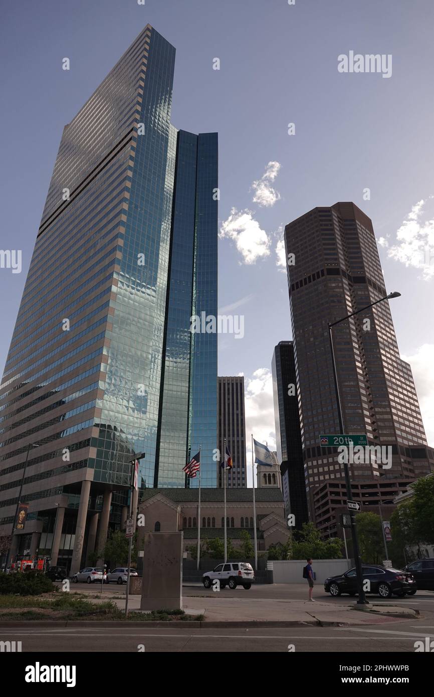 A cluster of buildings against a cloudy sky Stock Photo - Alamy