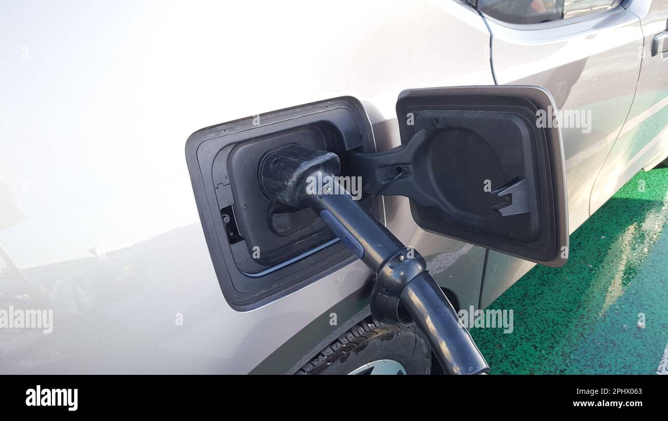 Electric cars in the row ready for charge loading energy of an ...
