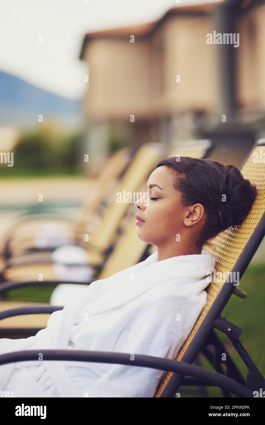 Theres no place like alone. an attractive young woman relaxing on a ...