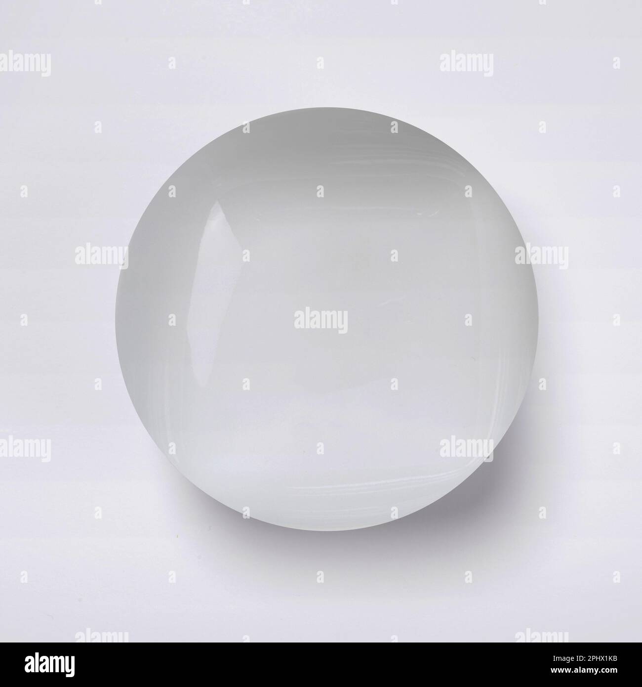Small empty white dish isolated on white background Stock Photo - Alamy