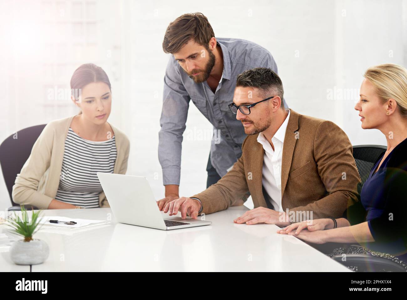 Collaboration is key to a successful project. A group of businesspeople ...