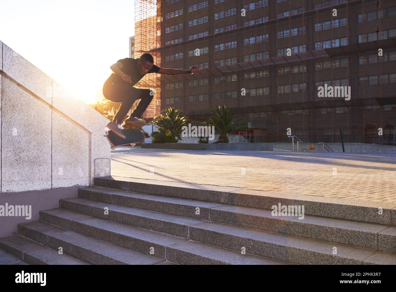 Its all downhill from here. a young skater skating down a flight of ...