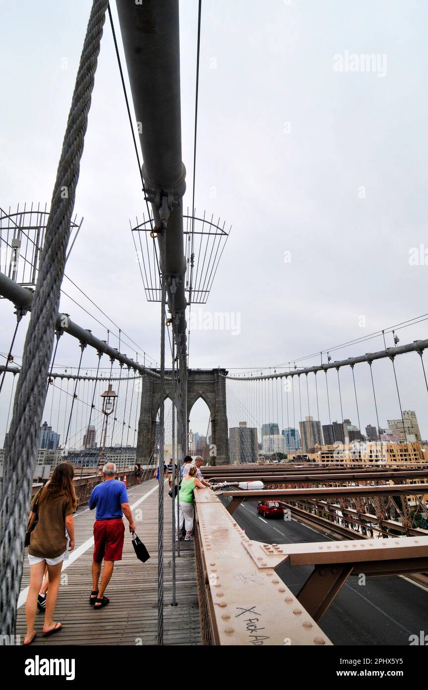 Walking on the iconic Brooklyn Bridge in New York City, NY, USA Stock ...