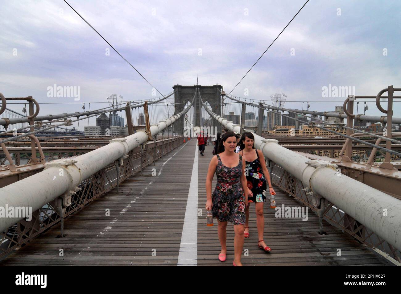 Walking on the iconic Brooklyn Bridge in New York City, NY, USA Stock ...