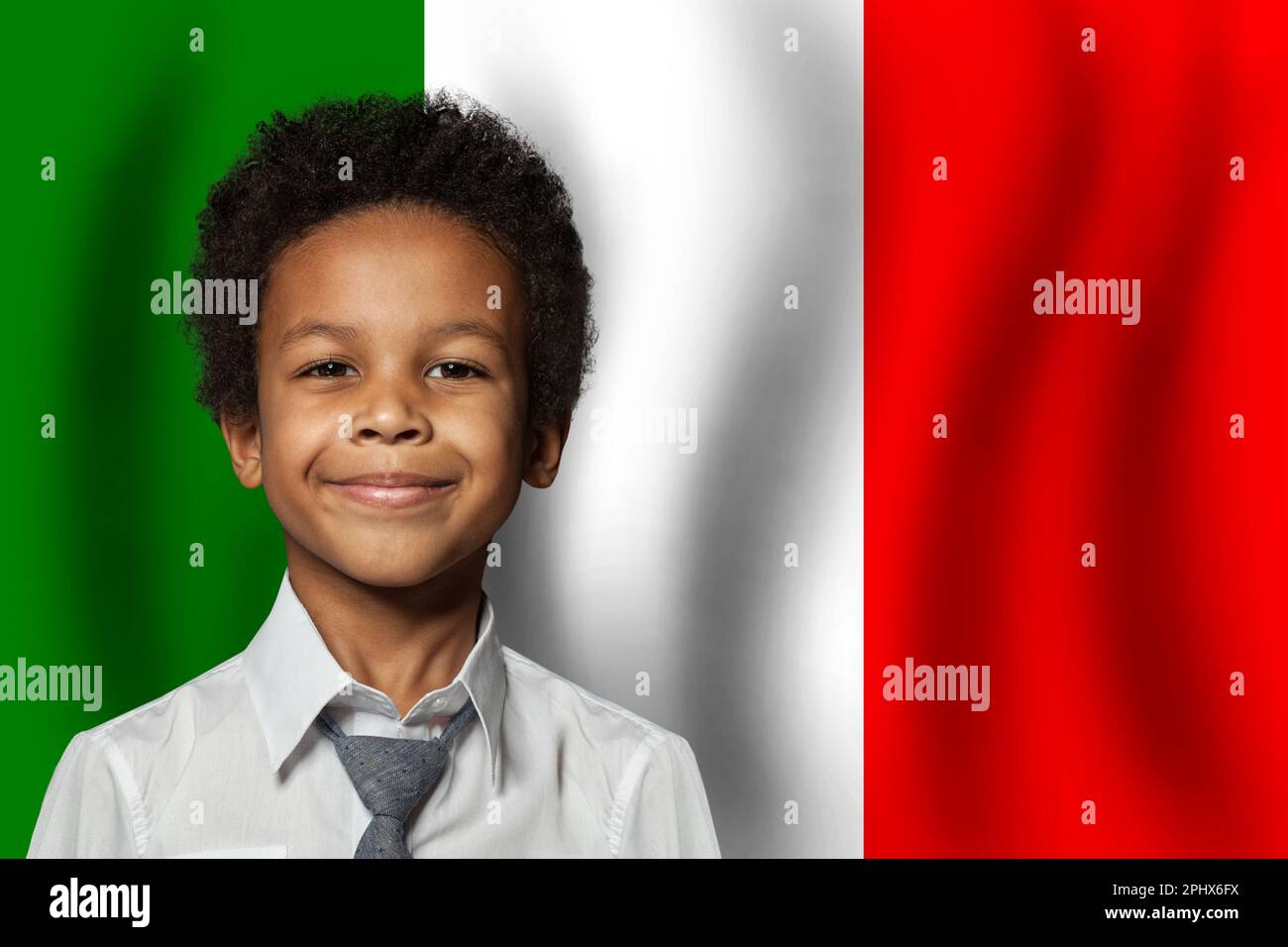 Italian kid boy on flag of Italy background. Education and childhood ...