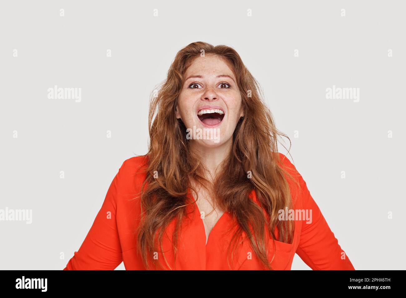 Happy excited woman redhead female laughing on white Stock Photo - Alamy