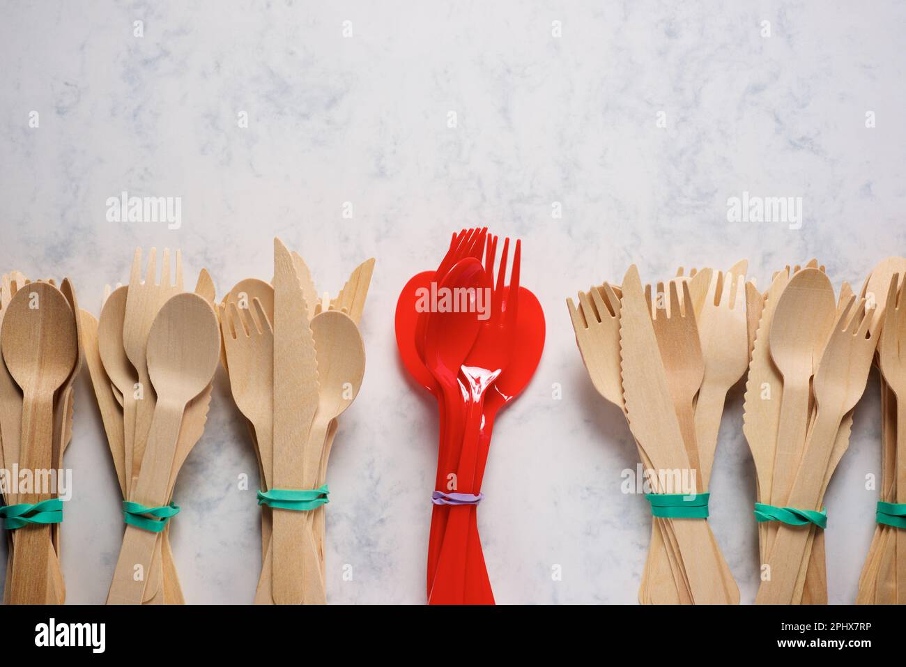Disposable plastic and wooden cutlery on a table Stock Photo - Alamy