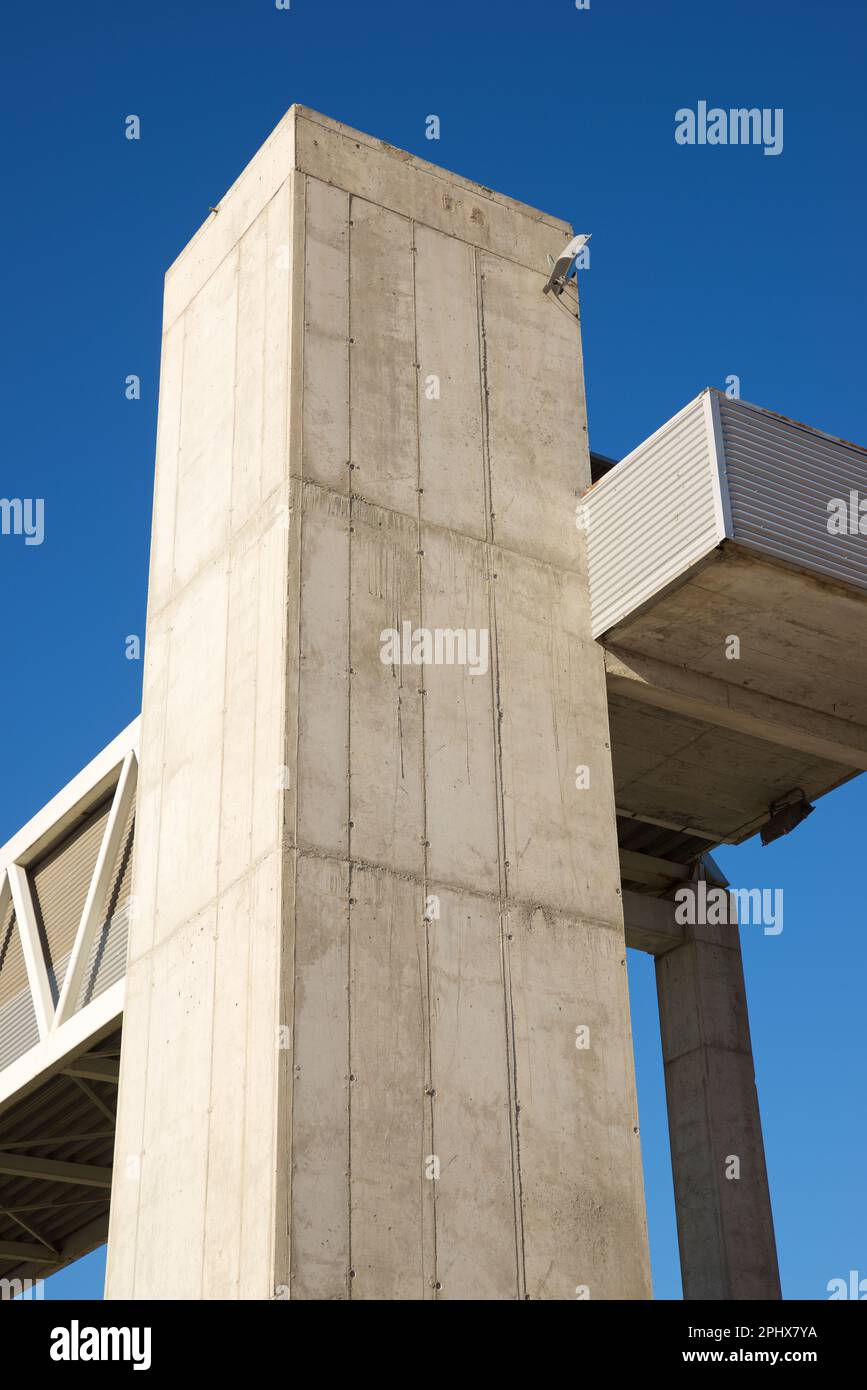 Concrete footbridge for the passage of people over a railroad track in ...