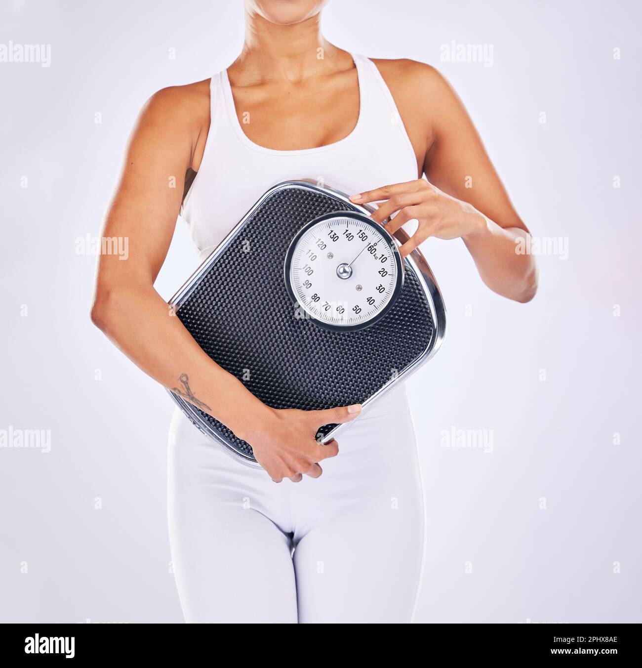 Hand, scale and woman in studio for wellness, motivation and body ...