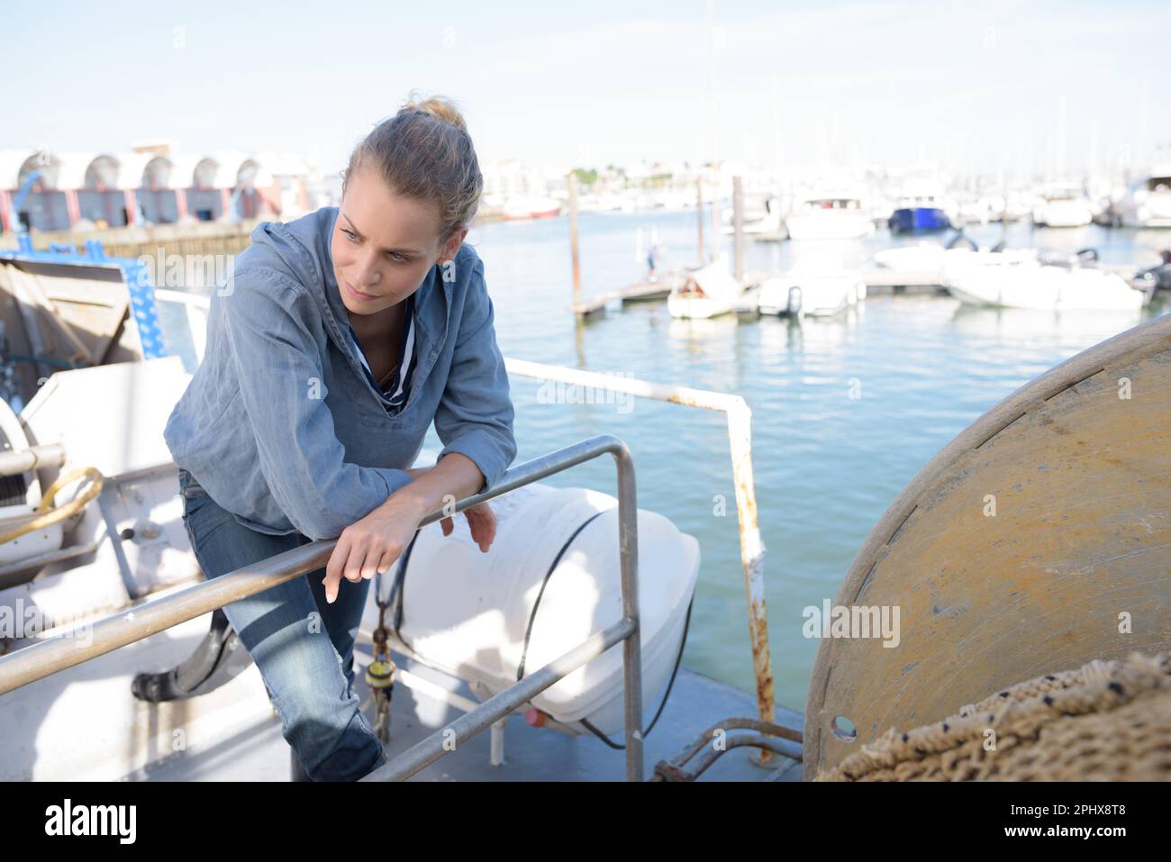Cheerful young woman checking car hi-res stock photography and images ...