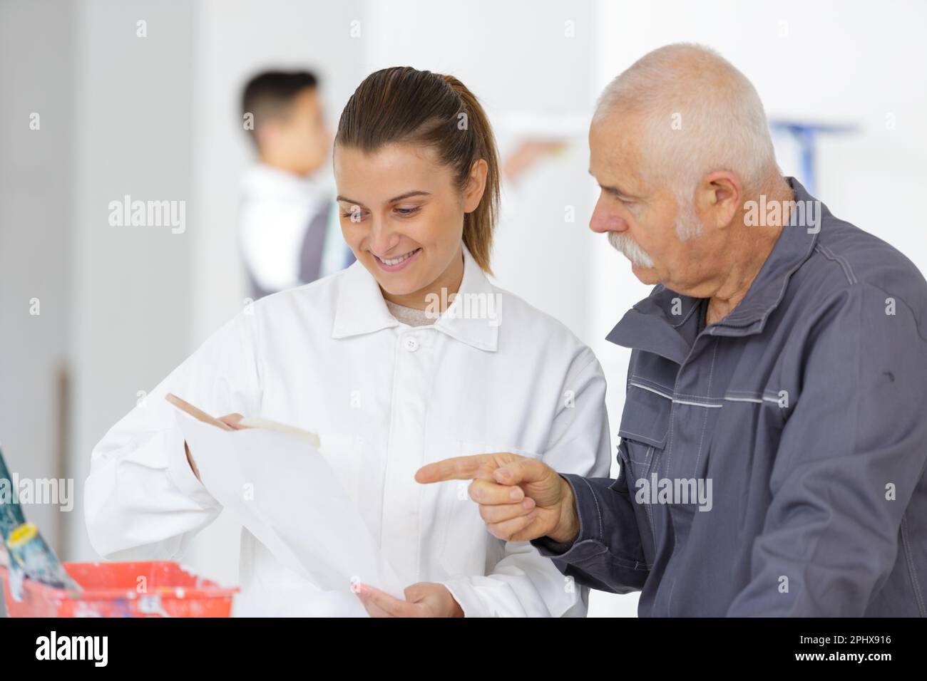decorating team painting a room Stock Photo - Alamy
