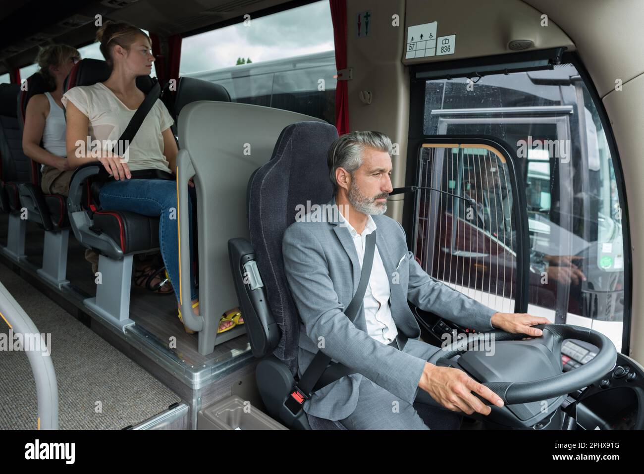 picture of a male bus driver with passengers Stock Photo - Alamy