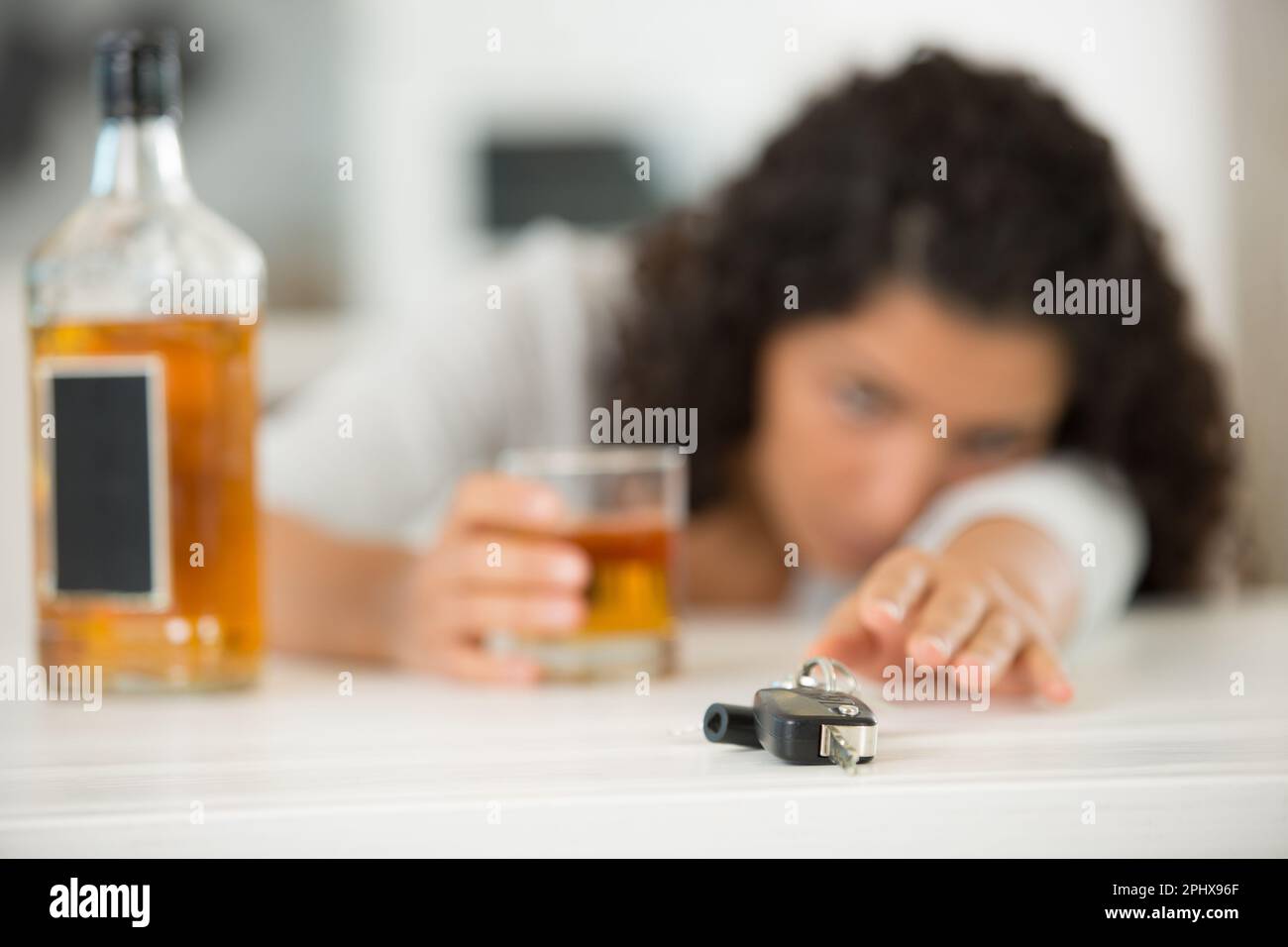 drunk woman driver leaning on counter Stock Photo - Alamy
