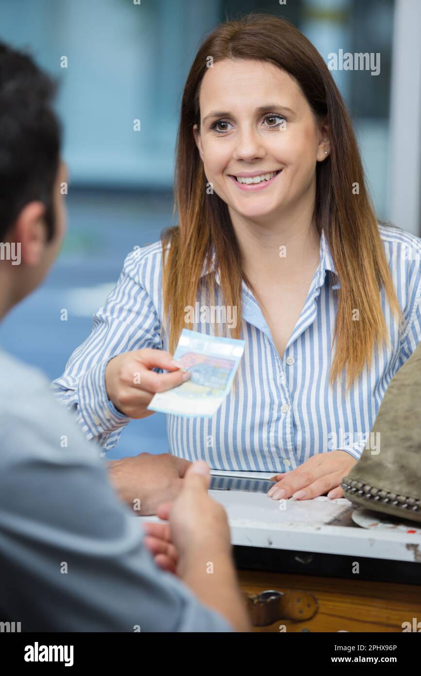 a client paying with cash Stock Photo - Alamy