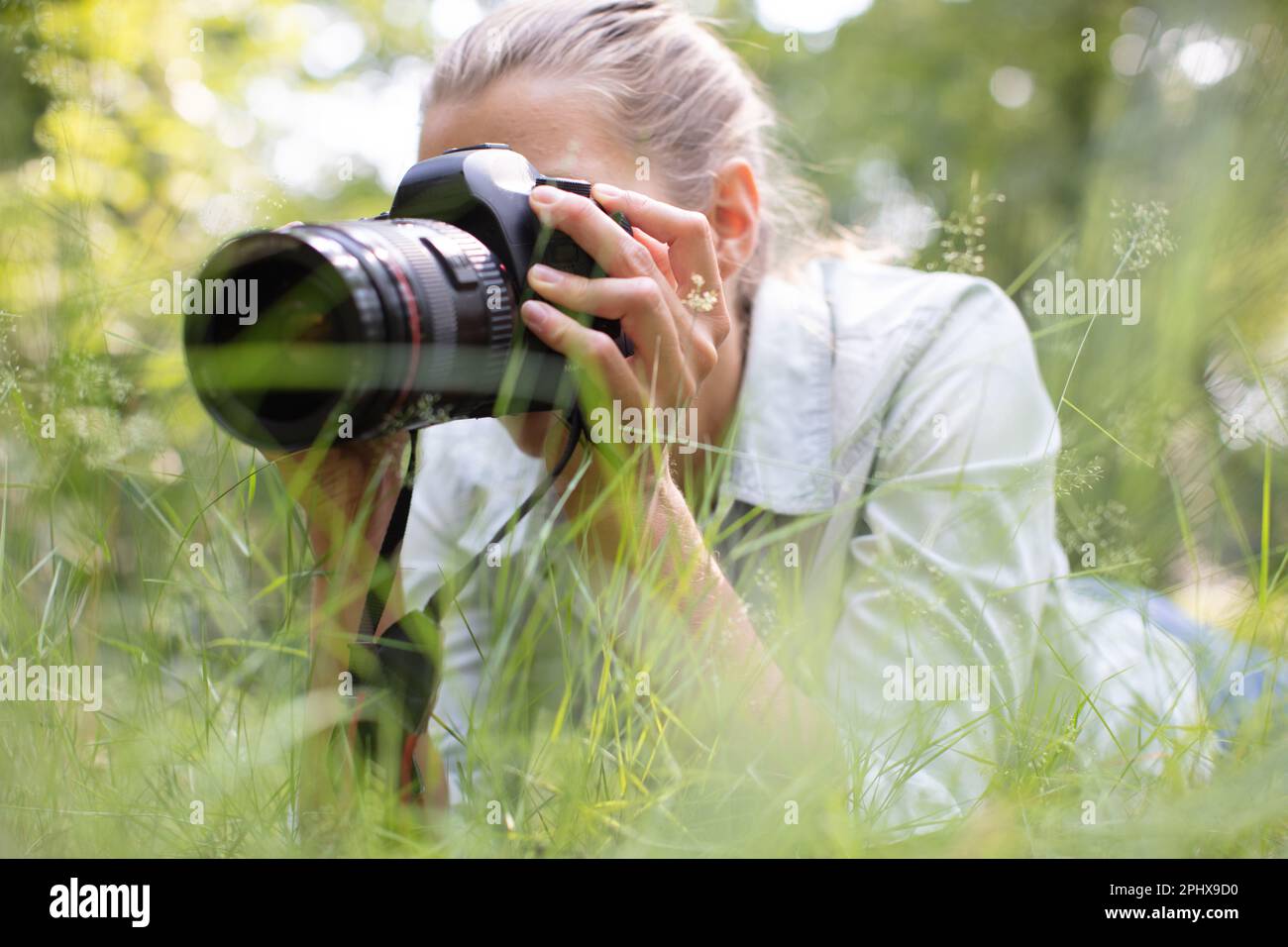 female hiker and landscape photographer photographing nature Stock ...