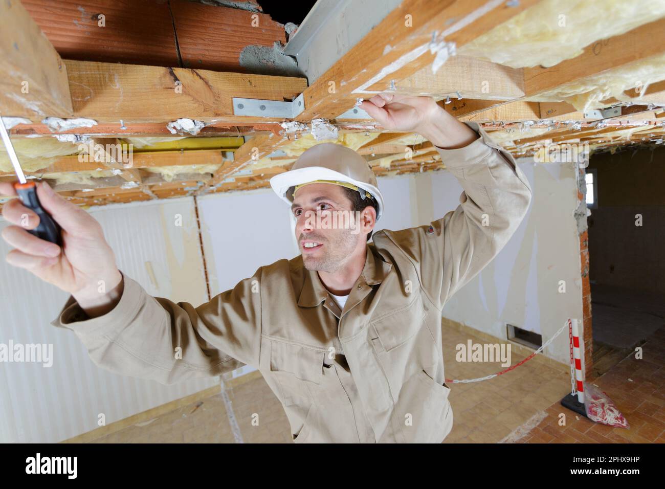 construction worker checking the ceiling Stock Photo - Alamy
