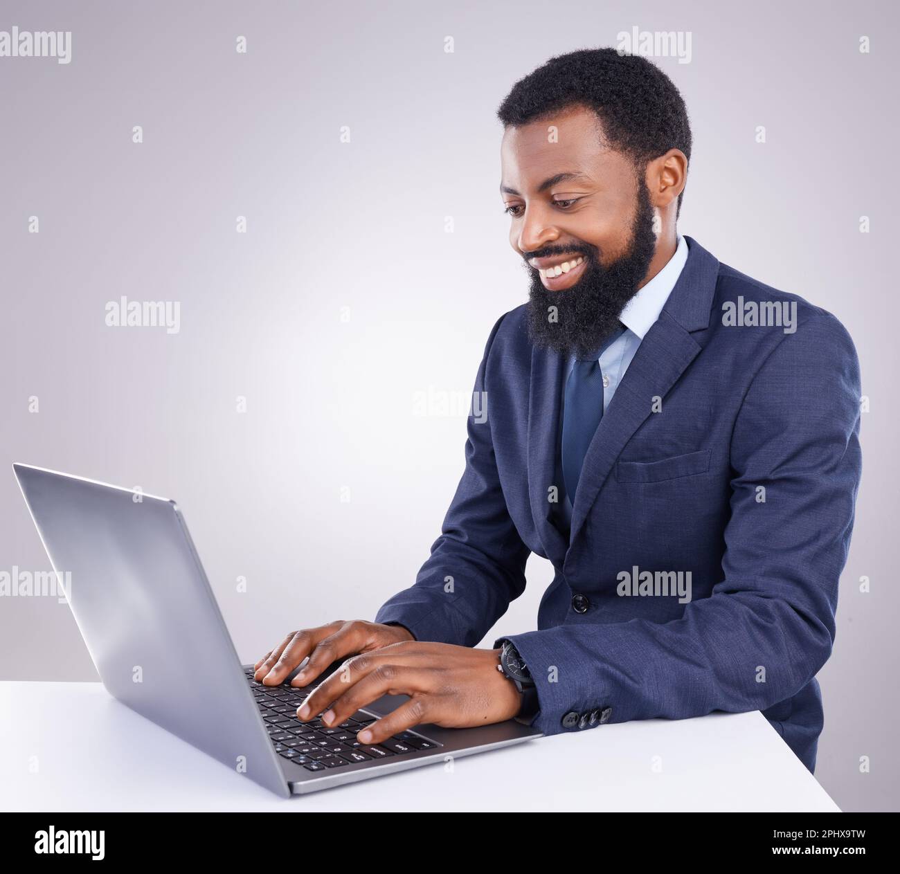 Happy black man, business and laptop in studio for planning, corporate ...