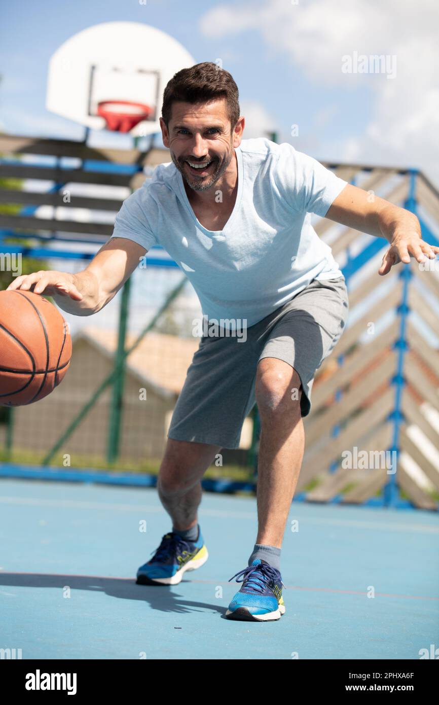 fit male playing basketball outdoor Stock Photo - Alamy
