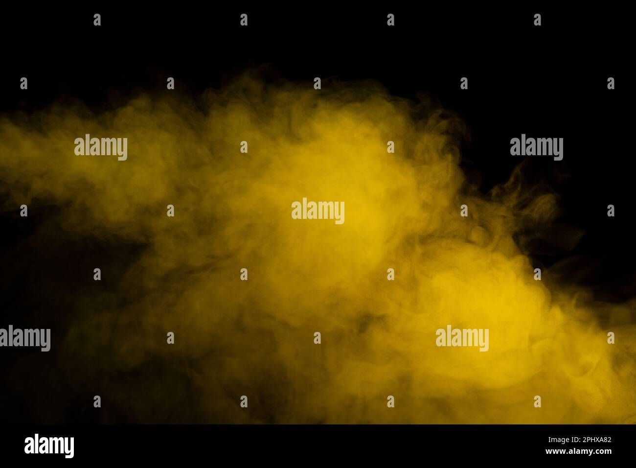 Yellow steam on a black background. Copy space Stock Photo - Alamy