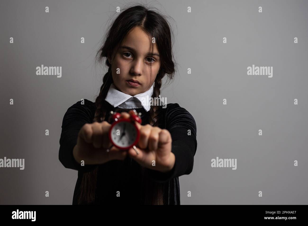Wednesday student girl on a dark background Stock Photo - Alamy
