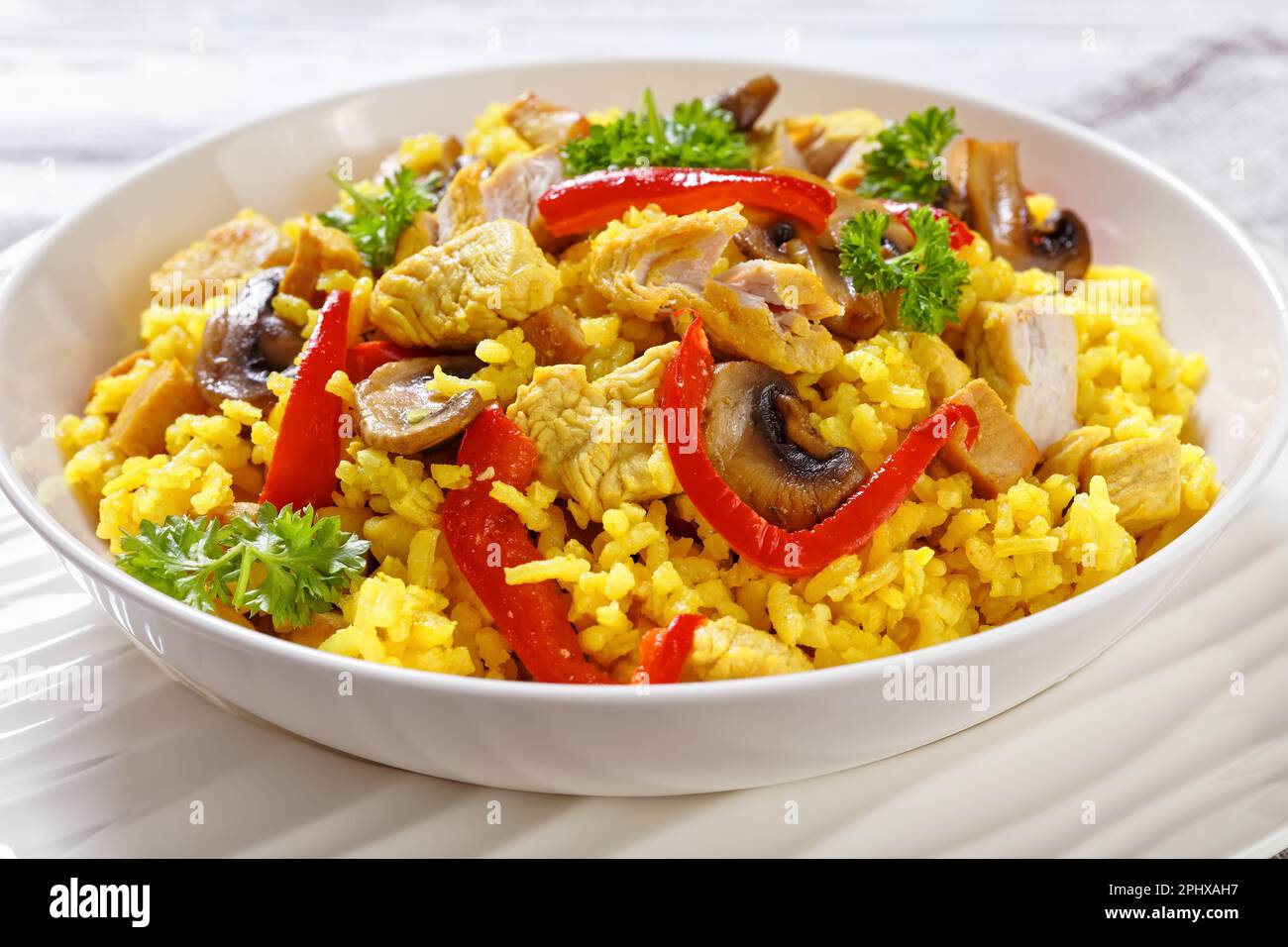 Chicken Paella of arborio rice, chicken fillet, mushrooms, julienned ...